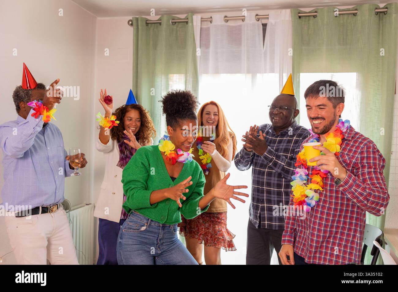 A lively birthday party scene featuring a group of friends dancing and ...