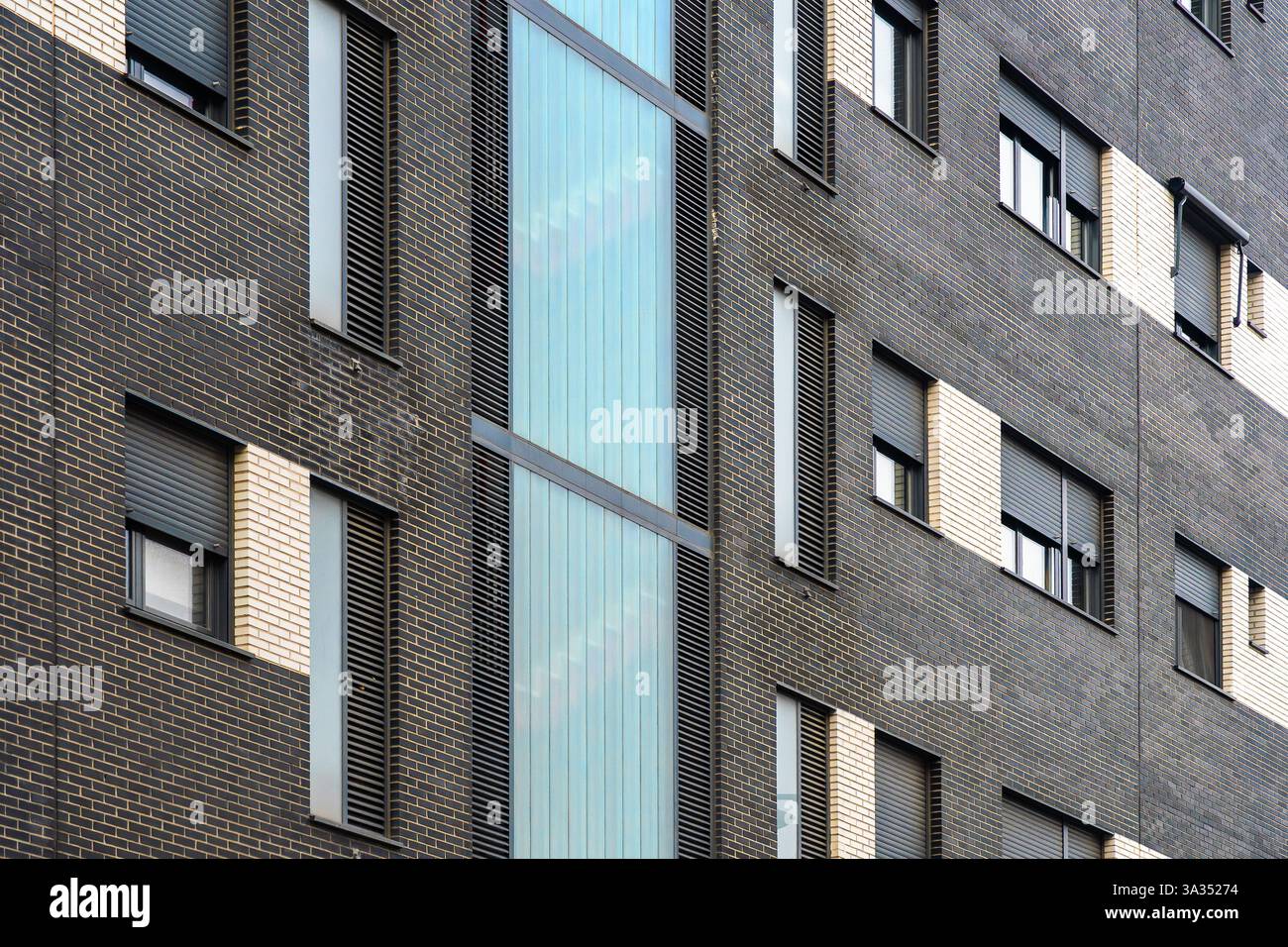 Striking image of a modern urban building featuring a blend of dark ...