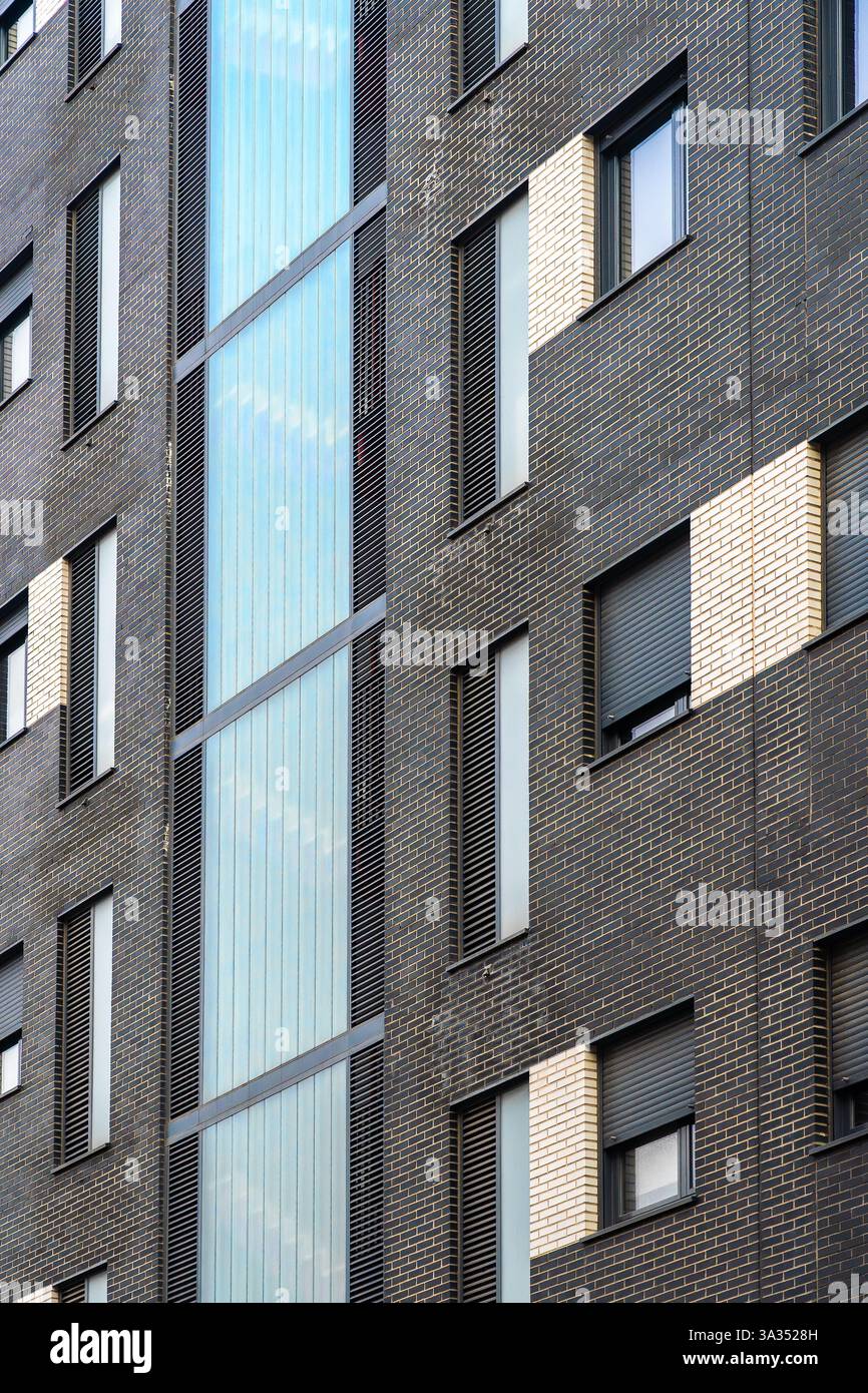 Striking image of a modern urban building featuring a blend of dark ...