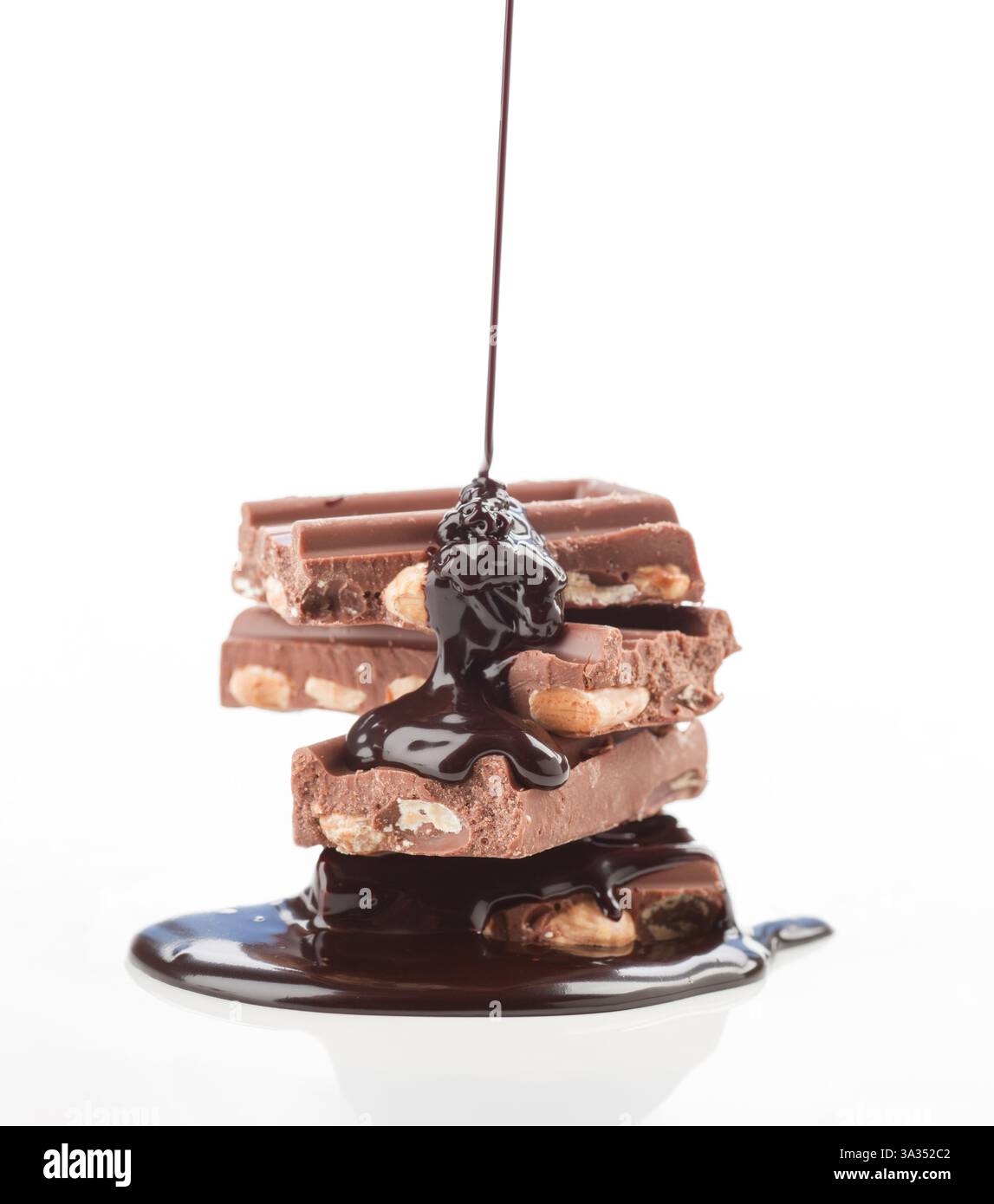A tempting visual of rich chocolate syrup cascading over stacked almond ...