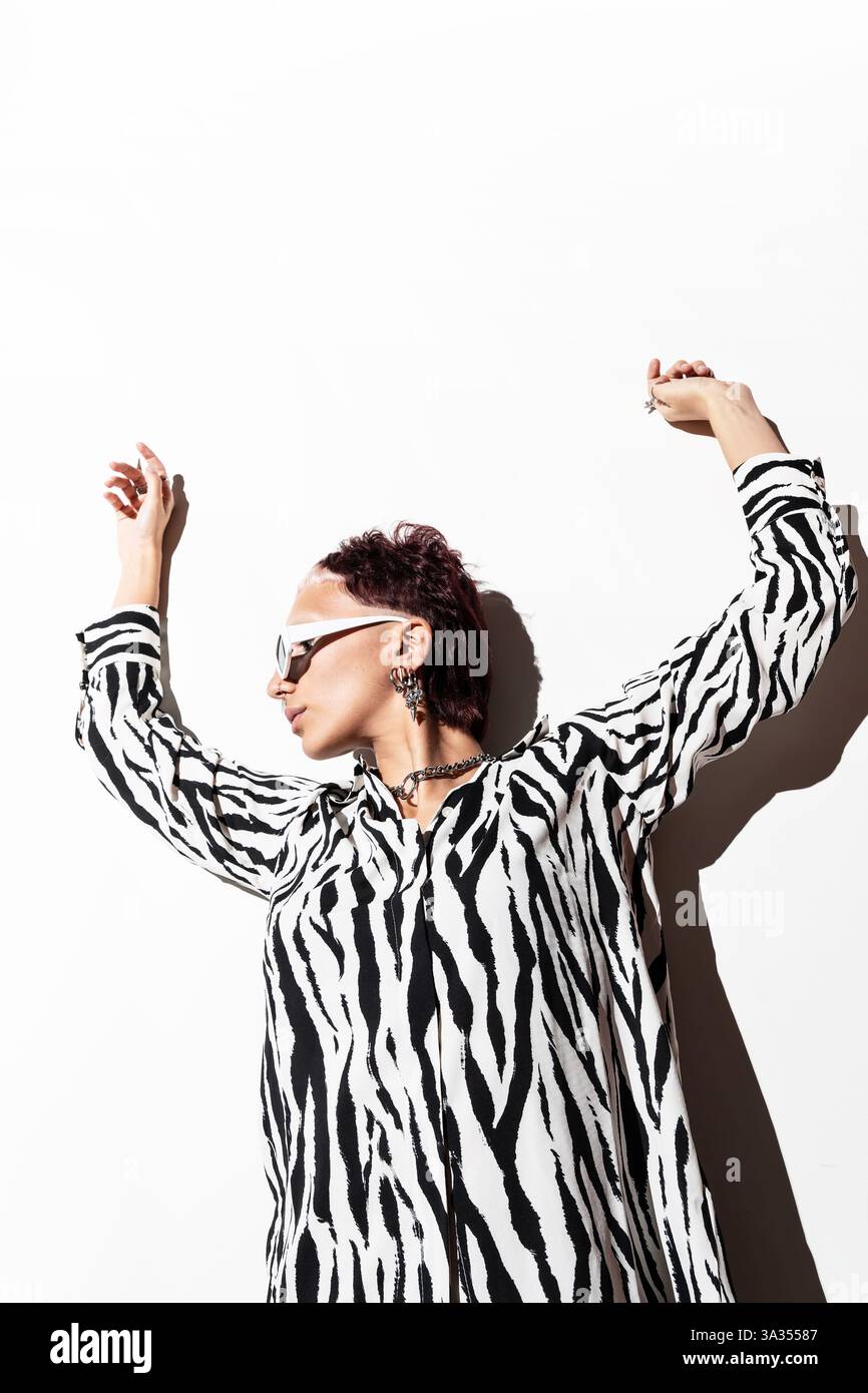 A fashion model exudes confidence wearing an eye-catching zebra animal ...