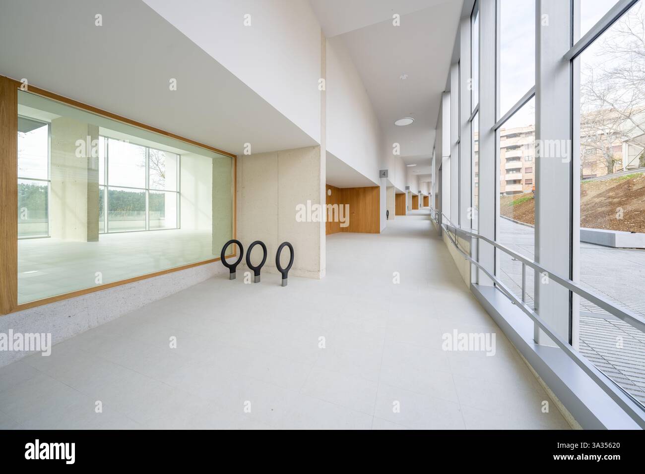Featuring a modern, airy corridor with minimalist design, vibrant ...
