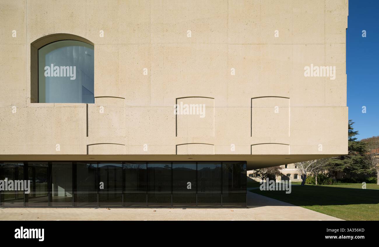 A modern, minimalist hospital facade featuring large geometric shapes ...