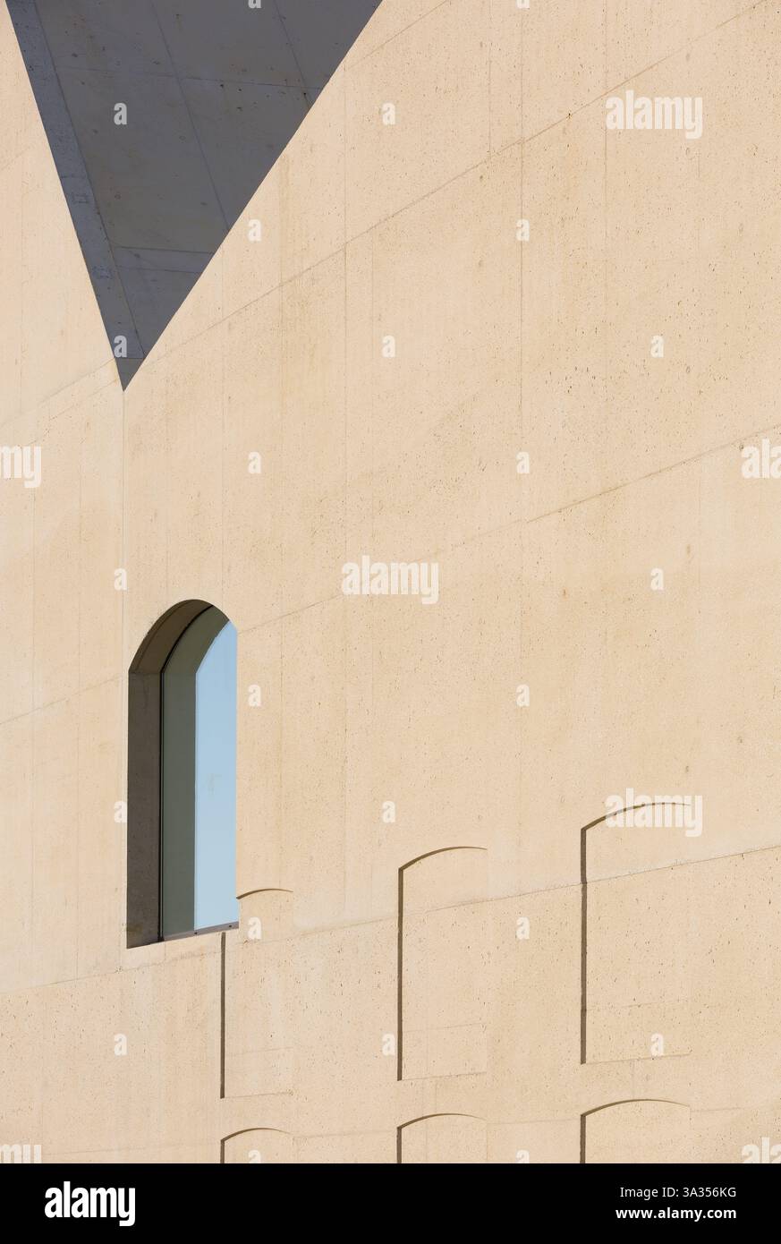 A minimalist hospital detail featuring beige concrete walls and arched ...