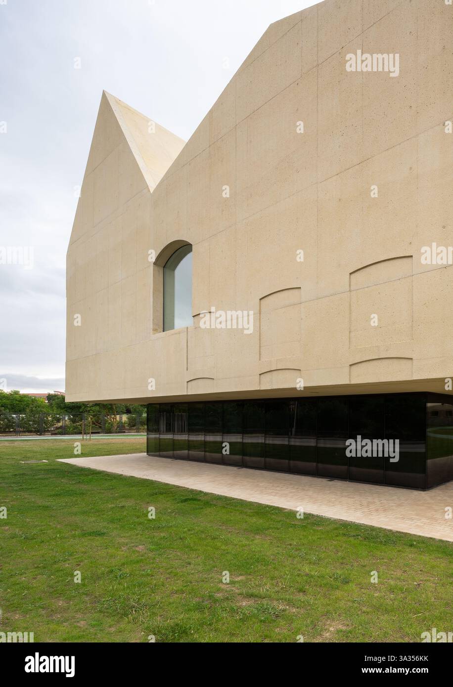 This image showcases an innovative hospital with a sleek, beige facade ...