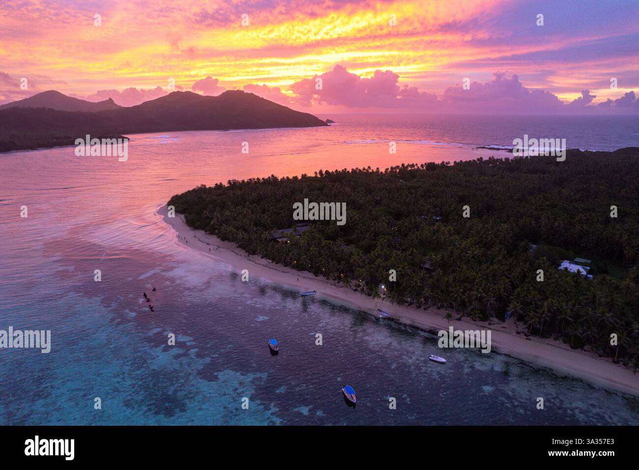 Aerial view of remote Tropical Islands surrounded by Coral Reefs in ...