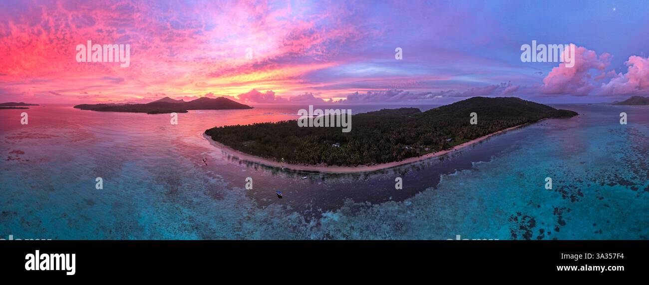 Aerial view of remote Tropical Islands surrounded by Coral Reefs in ...