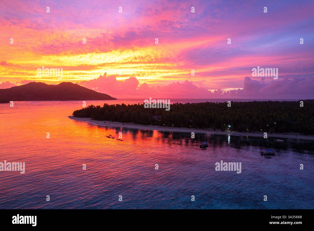 Aerial view of remote Tropical Islands surrounded by Coral Reefs in ...