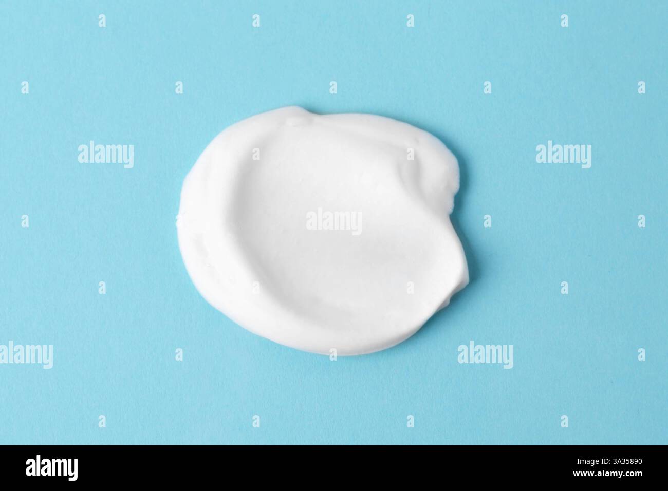 Sample of fluffy foam on light blue background, top view Stock Photo ...