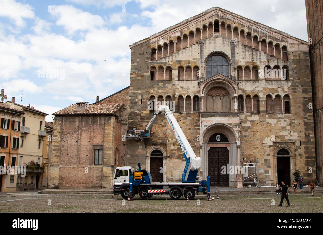 Expert restorers carefully restoring historic church wall preserving ...