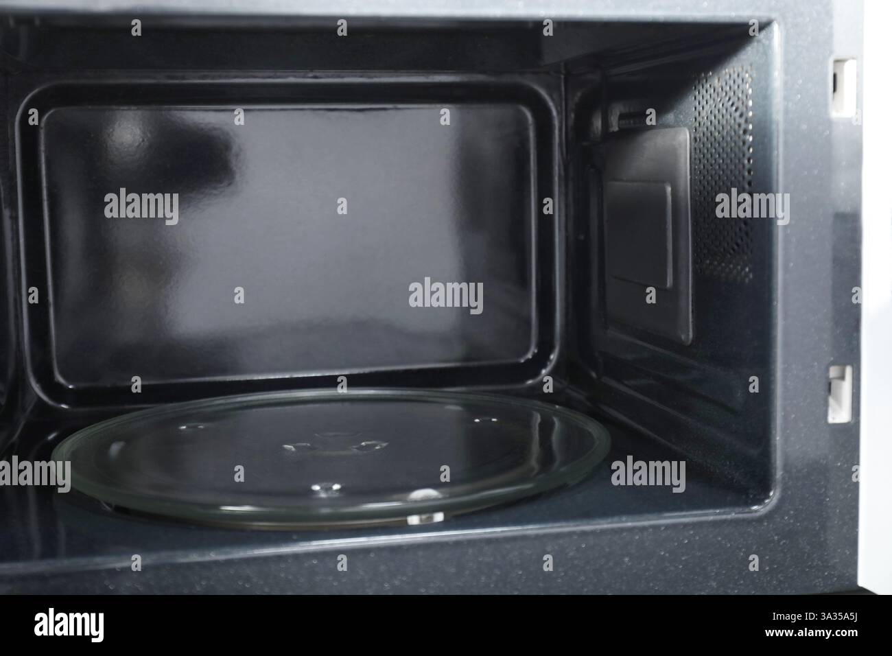 Open empty microwave oven, closeup. Inside view Stock Photo - Alamy