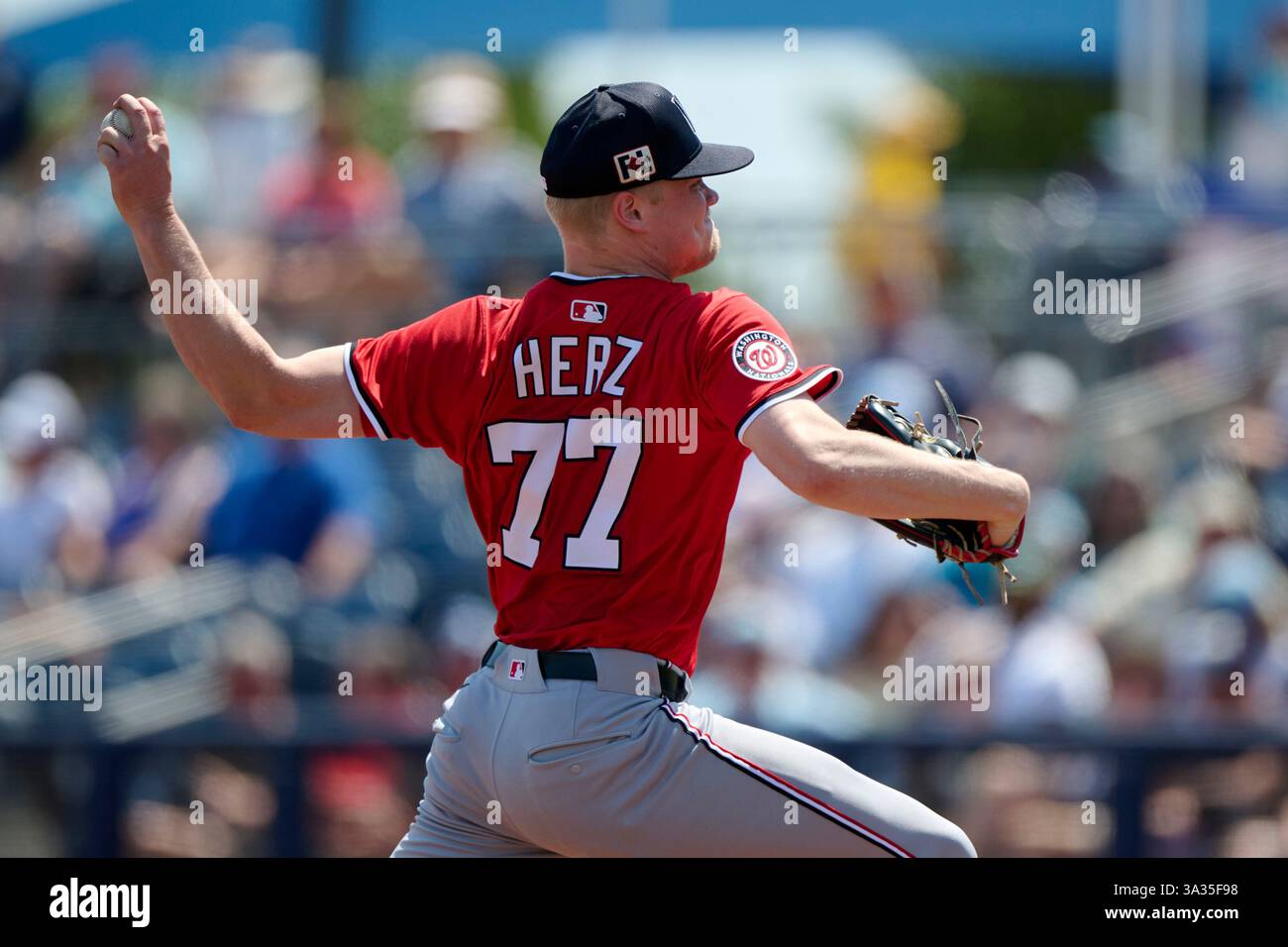 Washington Nationals pitcher DJ Herz (77) delivers a pitch during an ...