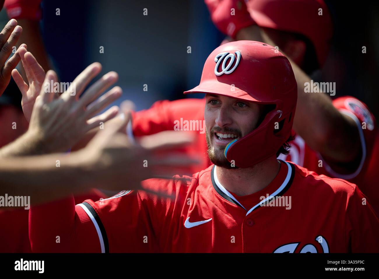 Washington Nationals Dylan Crews (3) high fives teammates after scoring ...
