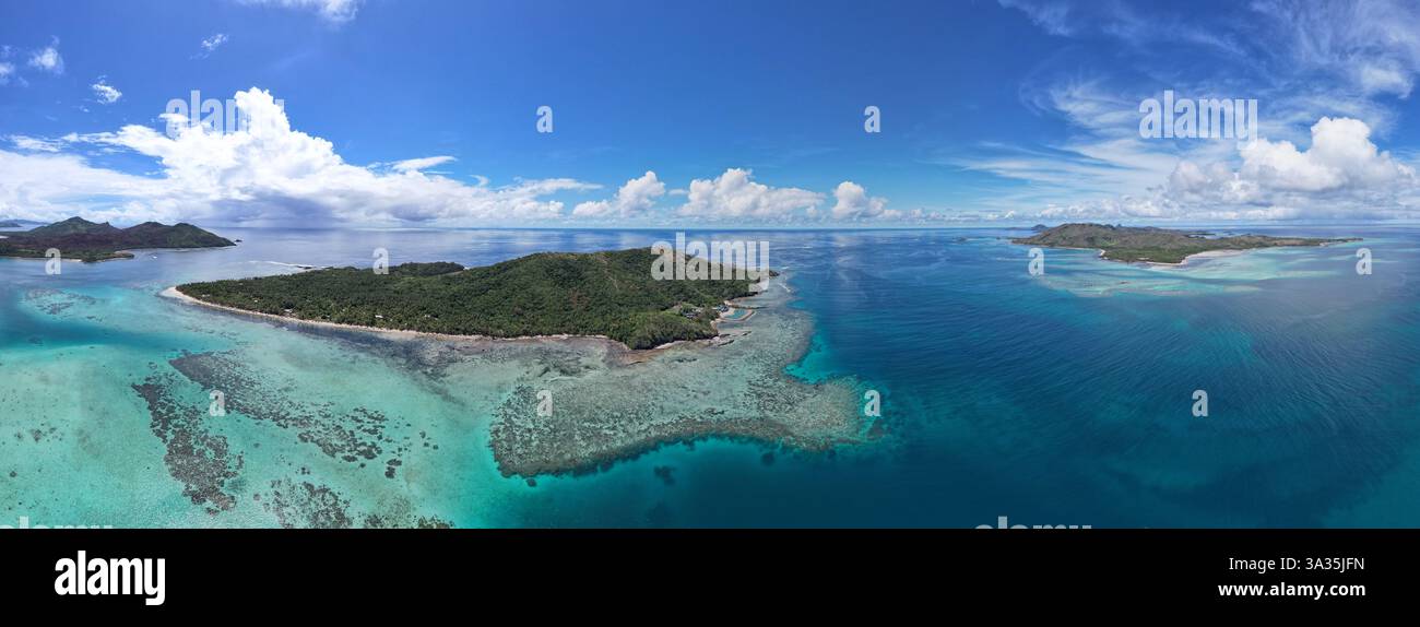 Aerial view of remote Tropical Islands surrounded by Coral Reefs in ...