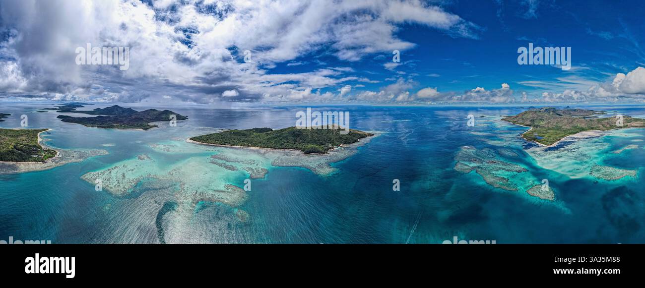 Aerial view of remote Tropical Islands surrounded by Coral Reefs in ...