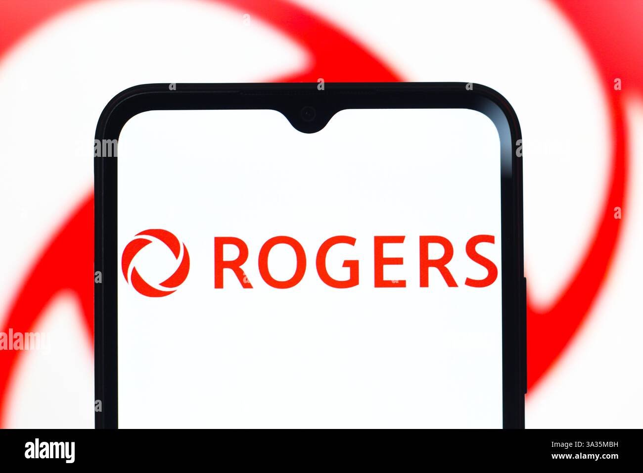 In this photo illustration, the Rogers Communications logo is seen displayed on a smartphone ...