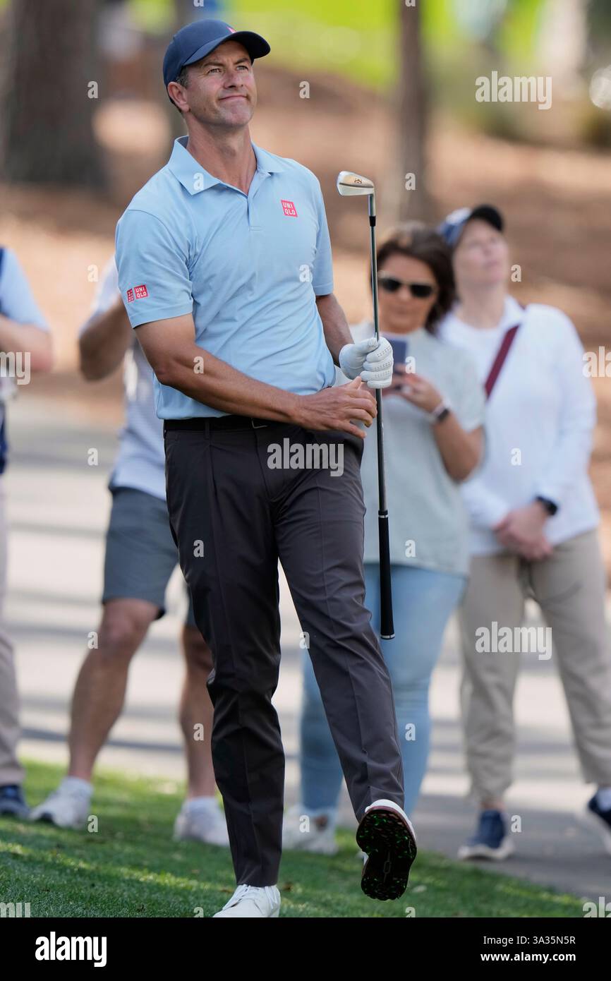 Adam Scott watches his second shot on the 15th hole during the second ...