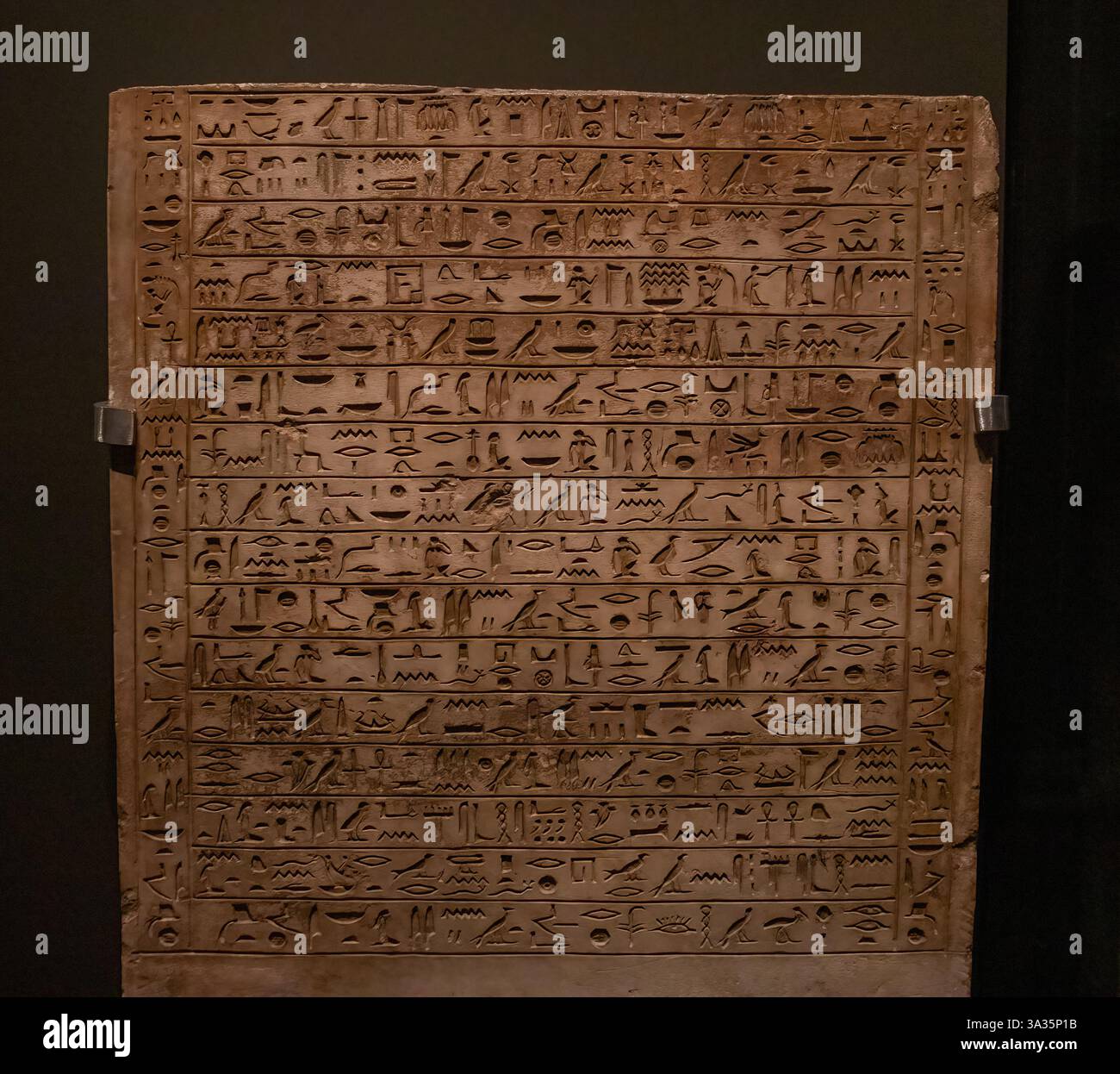 Ancient egyptian hieroglyphs carved on sand stone at the Grand Egyptian ...