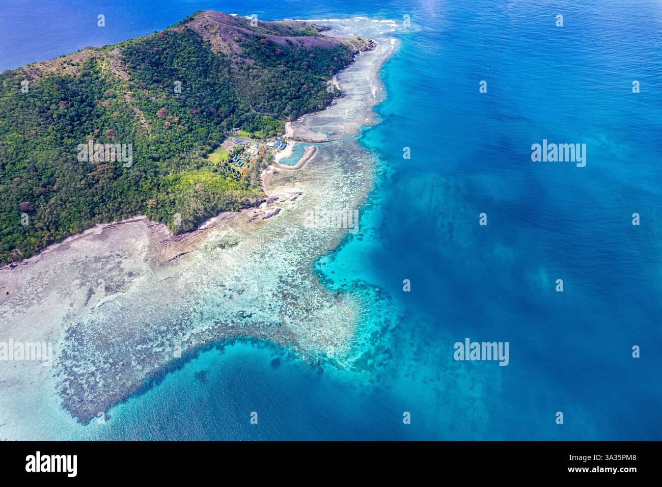 Aerial view of remote Tropical Islands surrounded by Coral Reefs in ...
