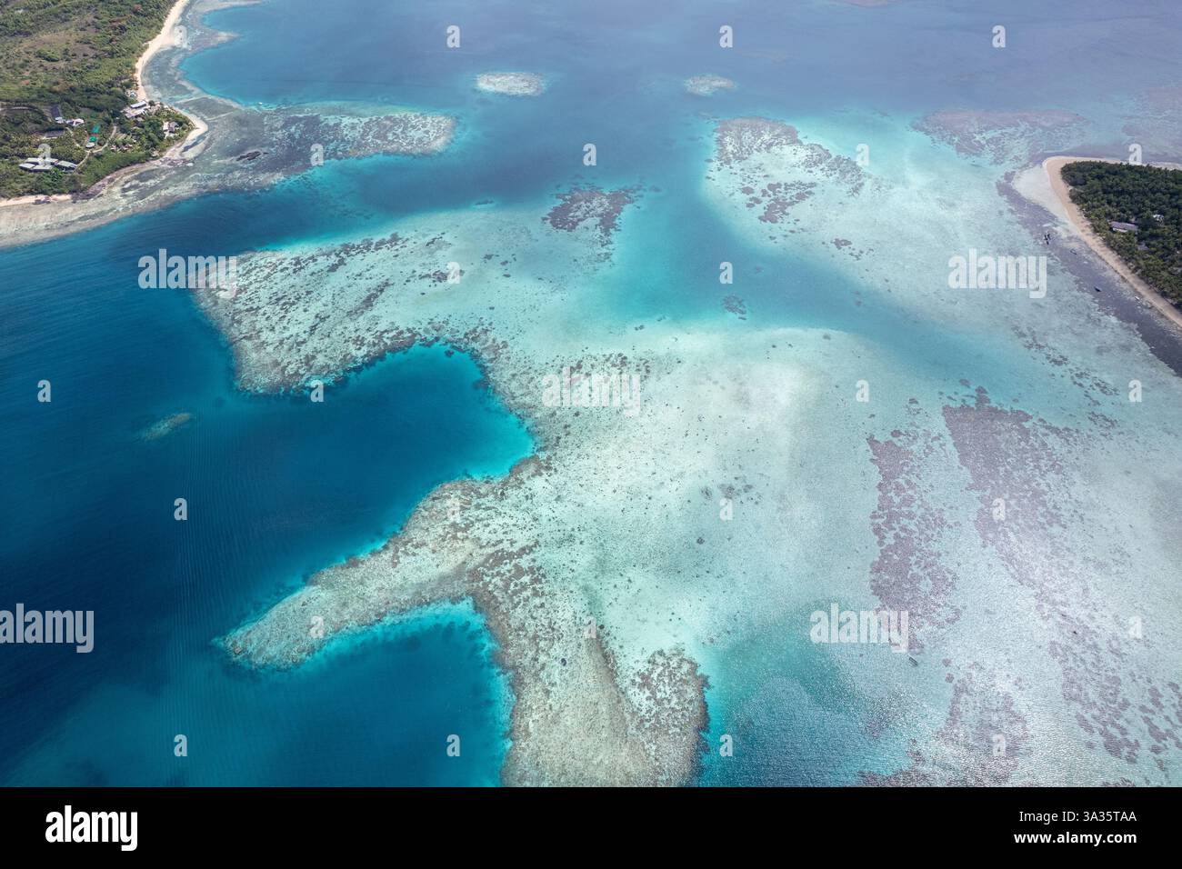 Aerial view of tropical coral reef in the Pacific Ocean in between ...