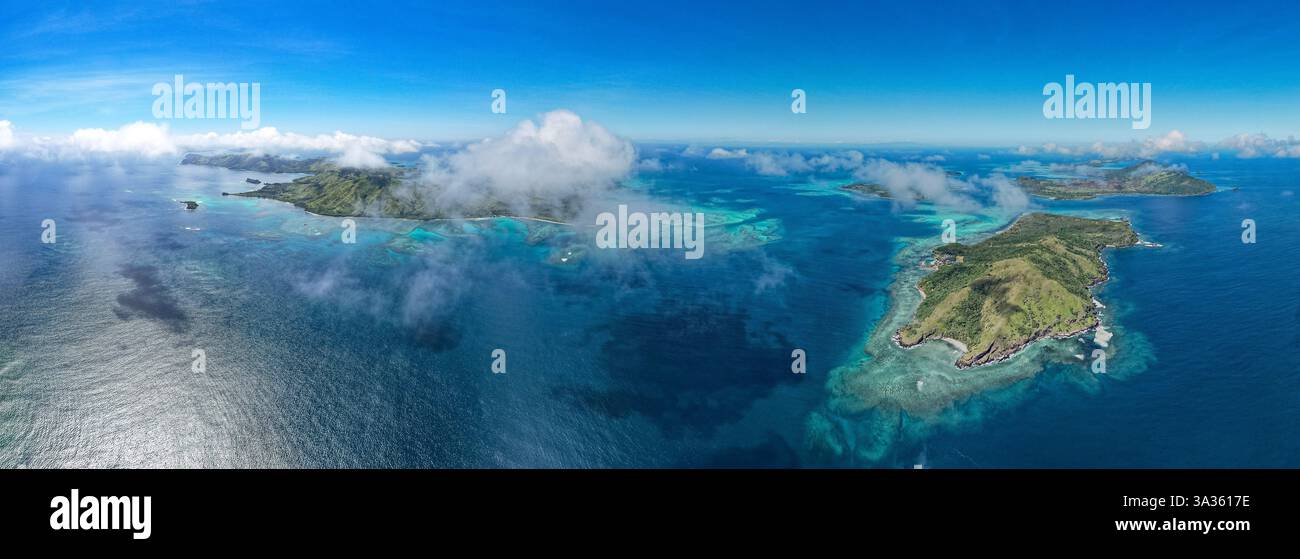 Aerial view of remote Tropical Islands surrounded by Coral Reefs in ...