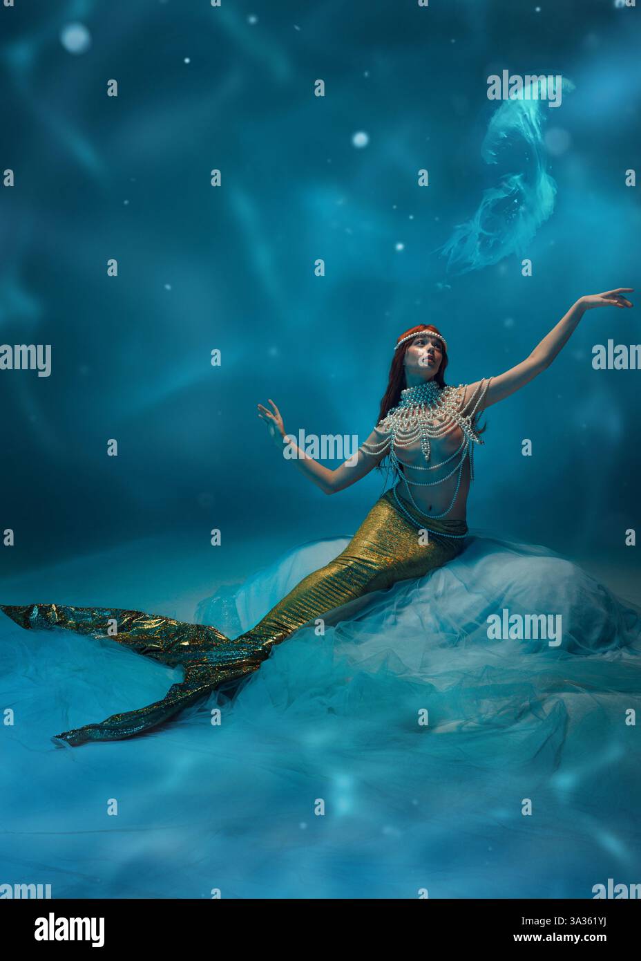 Graceful redhaired young woman, mermaid with elegant pearl accessories ...