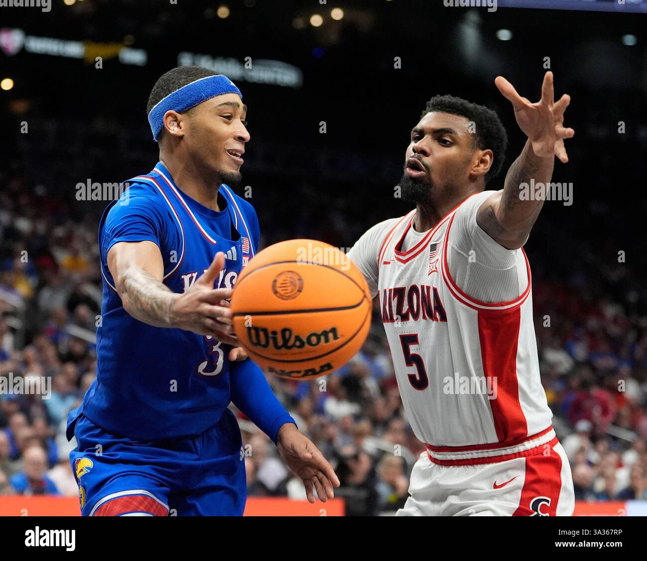MAR 13 2025: Kansas Jayhawks guard Dajuan Harris Jr. (3) passes the ...