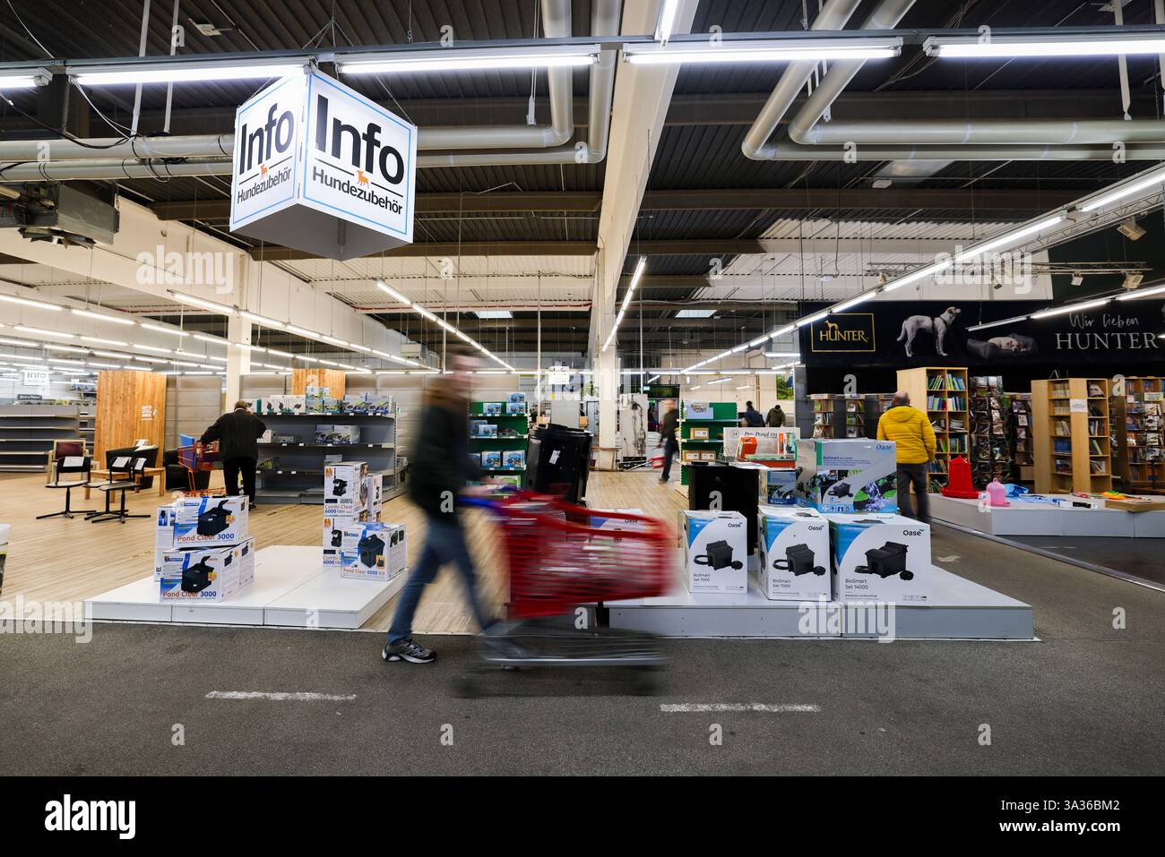 Duisburg, Germany. 14th Mar, 2025. A customer walks through the store ...