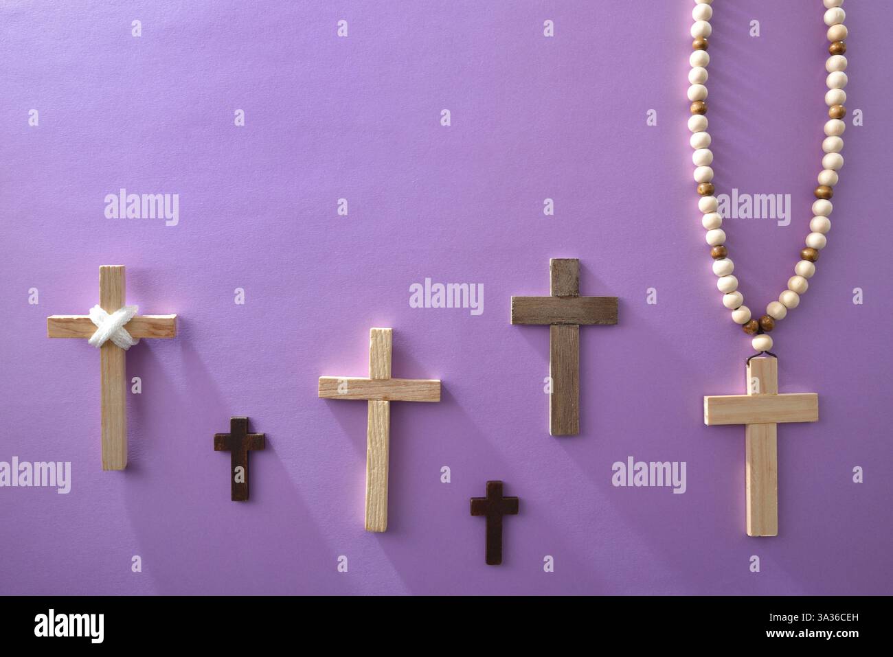 Group of basic wooden Christian crosses of different shades and sizes ...