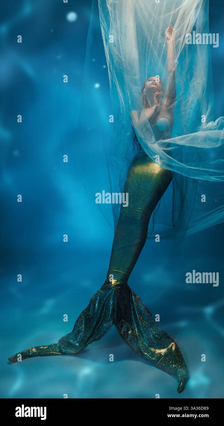 Tender young woman, mermaid covered in transparent veil, dancing ...