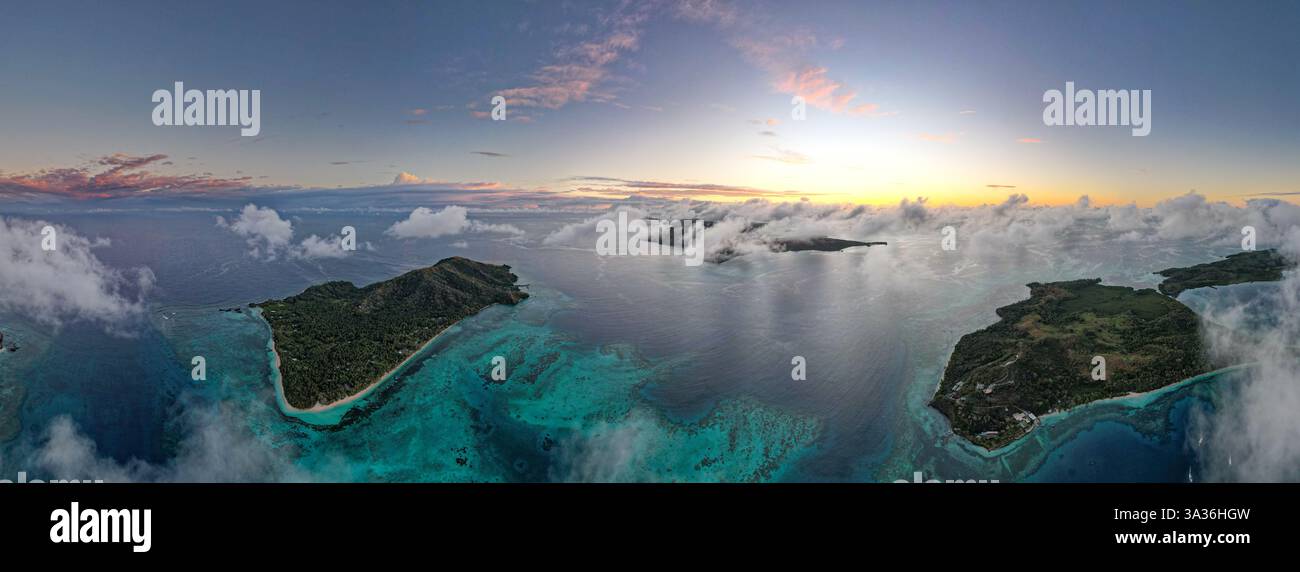 Aerial view of remote Tropical Islands surrounded by Coral Reefs in ...