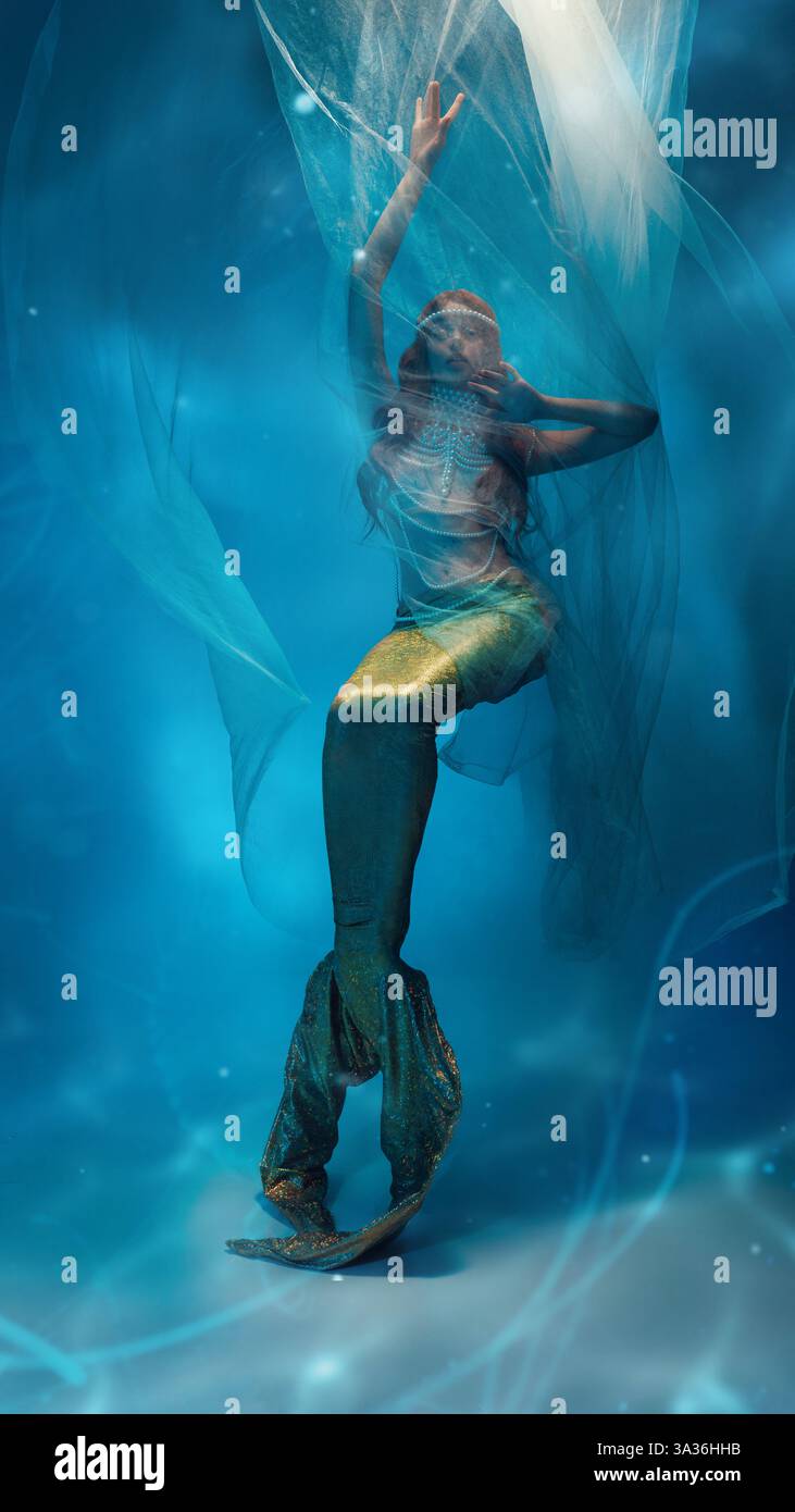 Creative portrait of beautiful redhaired young woman, mermaid with tail ...