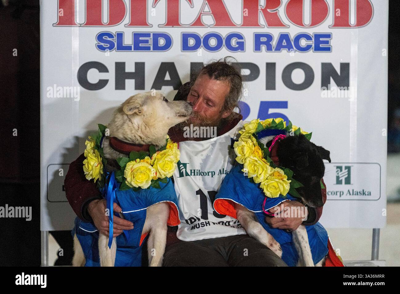 Jessie Holmes hugs his lead dogs Polar, left, and Hercules after ...