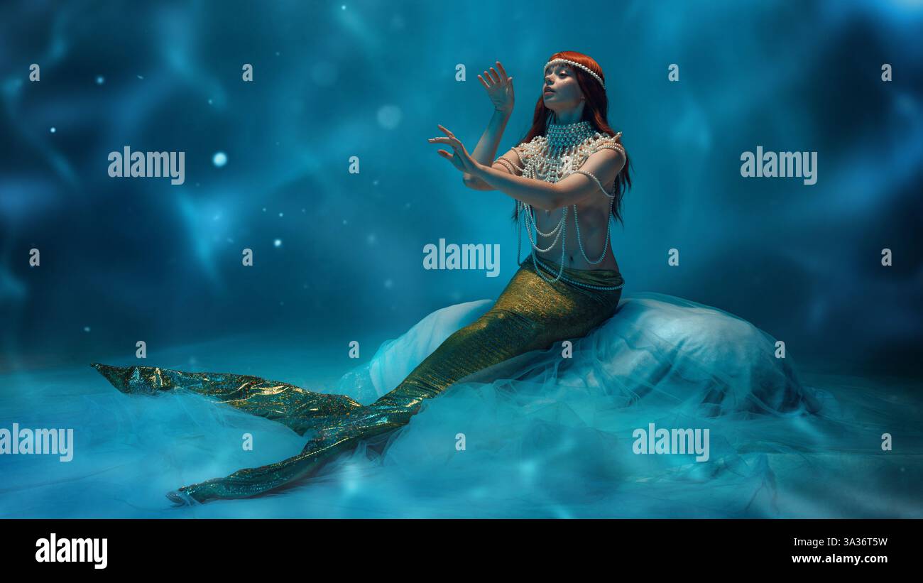 Fantasy touch. Beautiful young woman, graceful mermaid sitting in ...