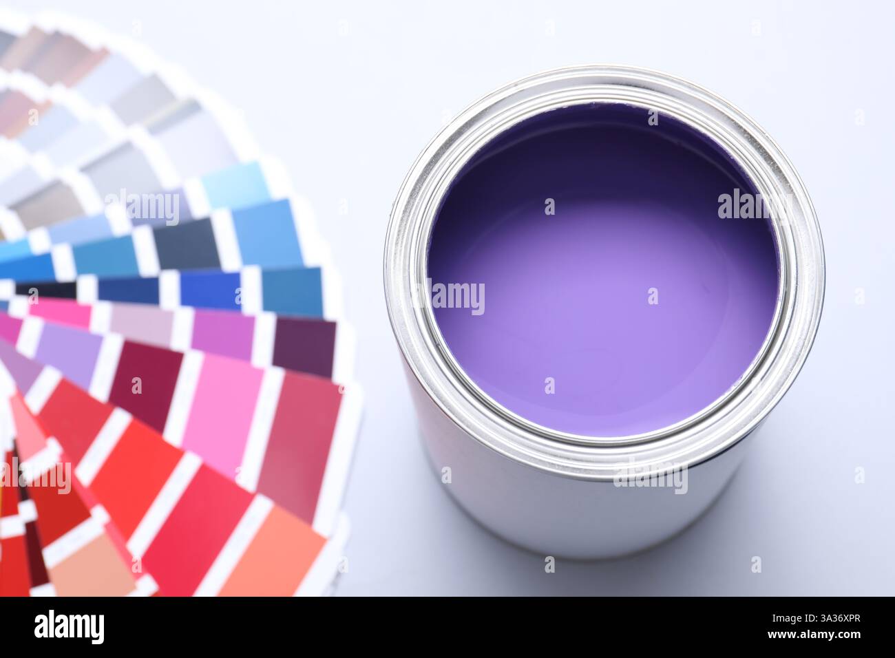 Can of bright paint and color palettes on light grey background Stock ...