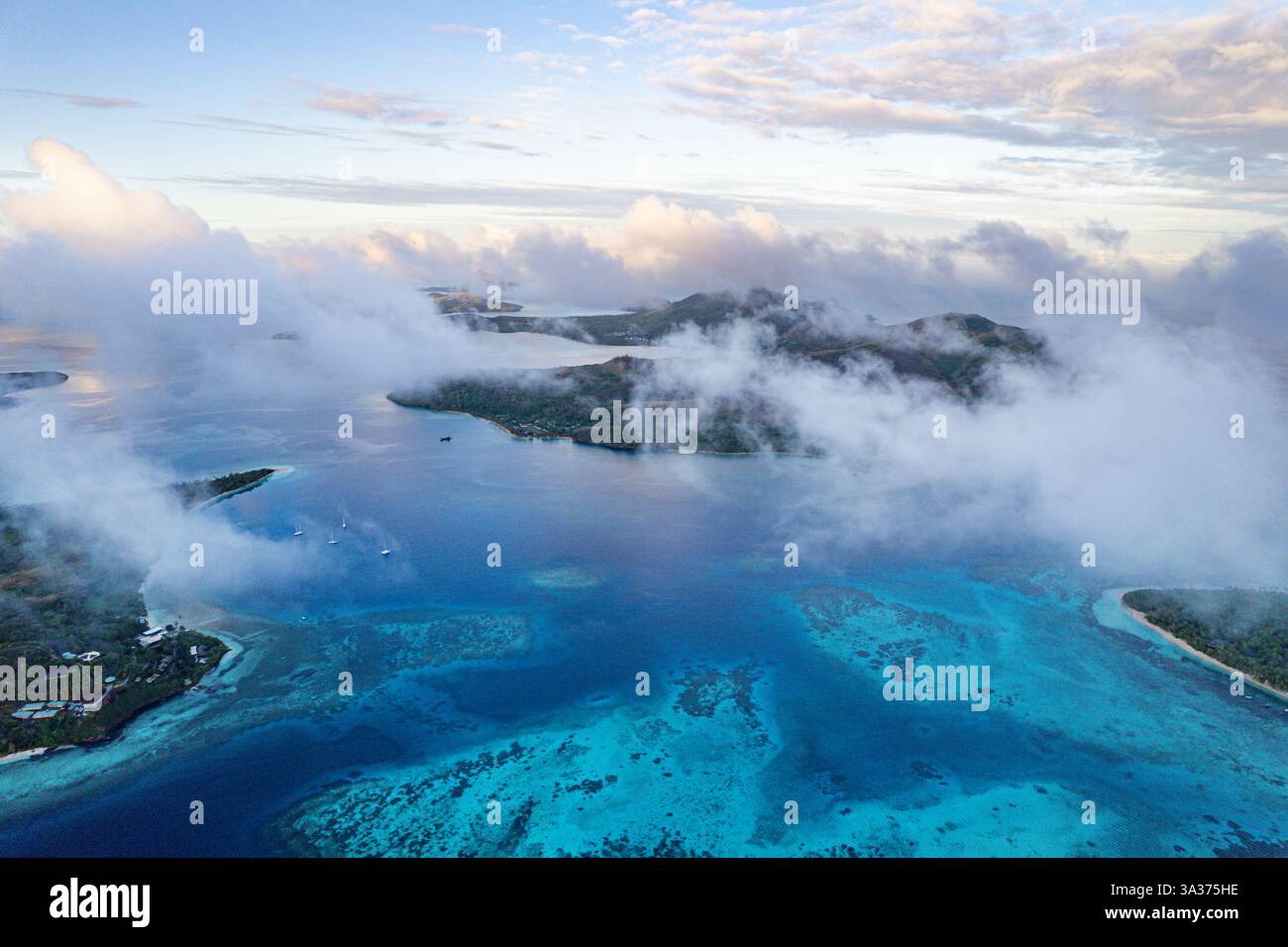 Aerial view of remote Tropical Islands surrounded by Coral Reefs in ...