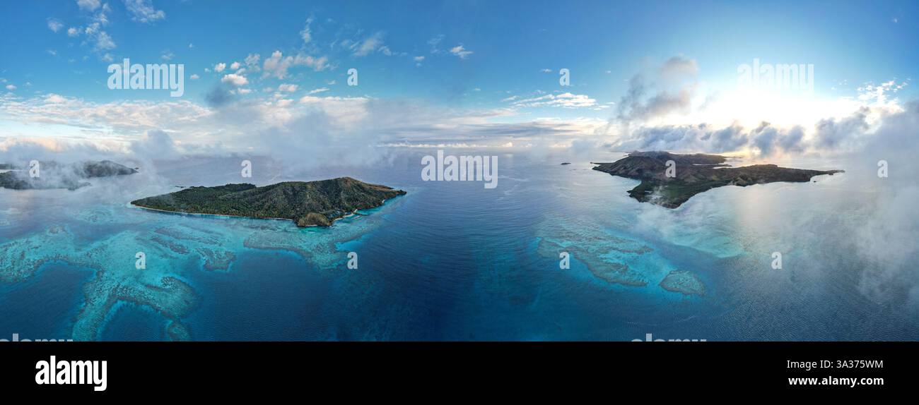 Aerial view of remote Tropical Islands surrounded by Coral Reefs in ...