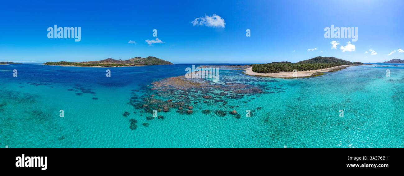 Aerial view of remote Tropical Islands surrounded by Coral Reefs in ...