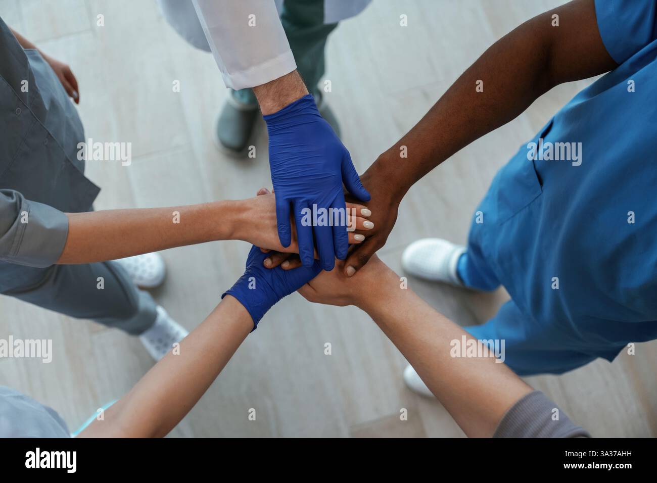 Group of doctors are holding hands in trust together Stock Photo - Alamy