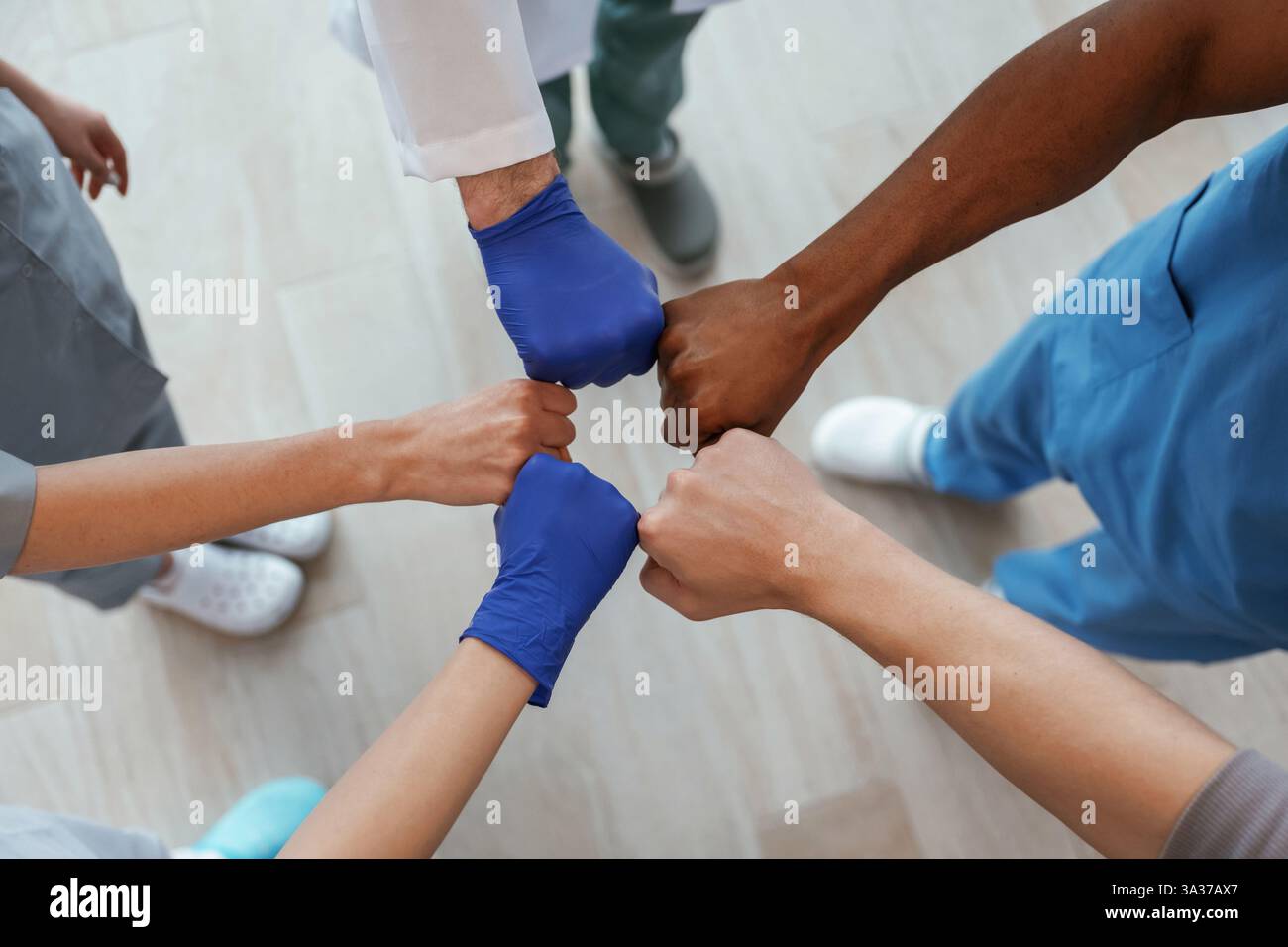 Group of doctors are holding hands in trust together Stock Photo - Alamy
