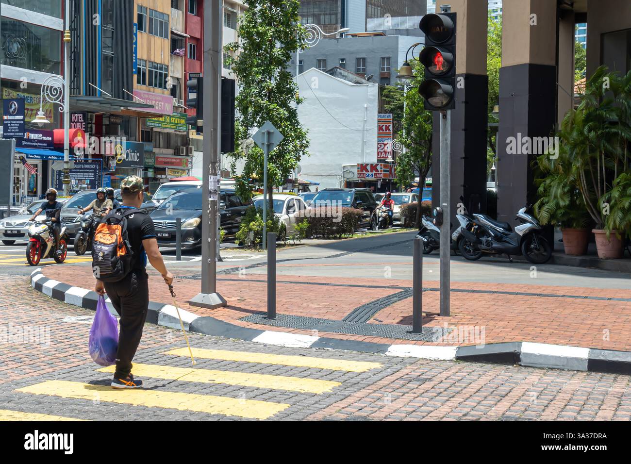 a pedestrian with white cane to designate visually impaired or blind ...