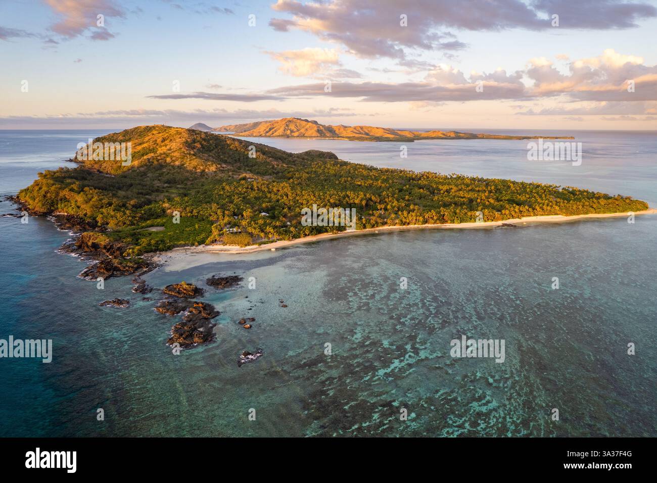 Aerial view of remote Tropical Islands surrounded by Coral Reefs in ...