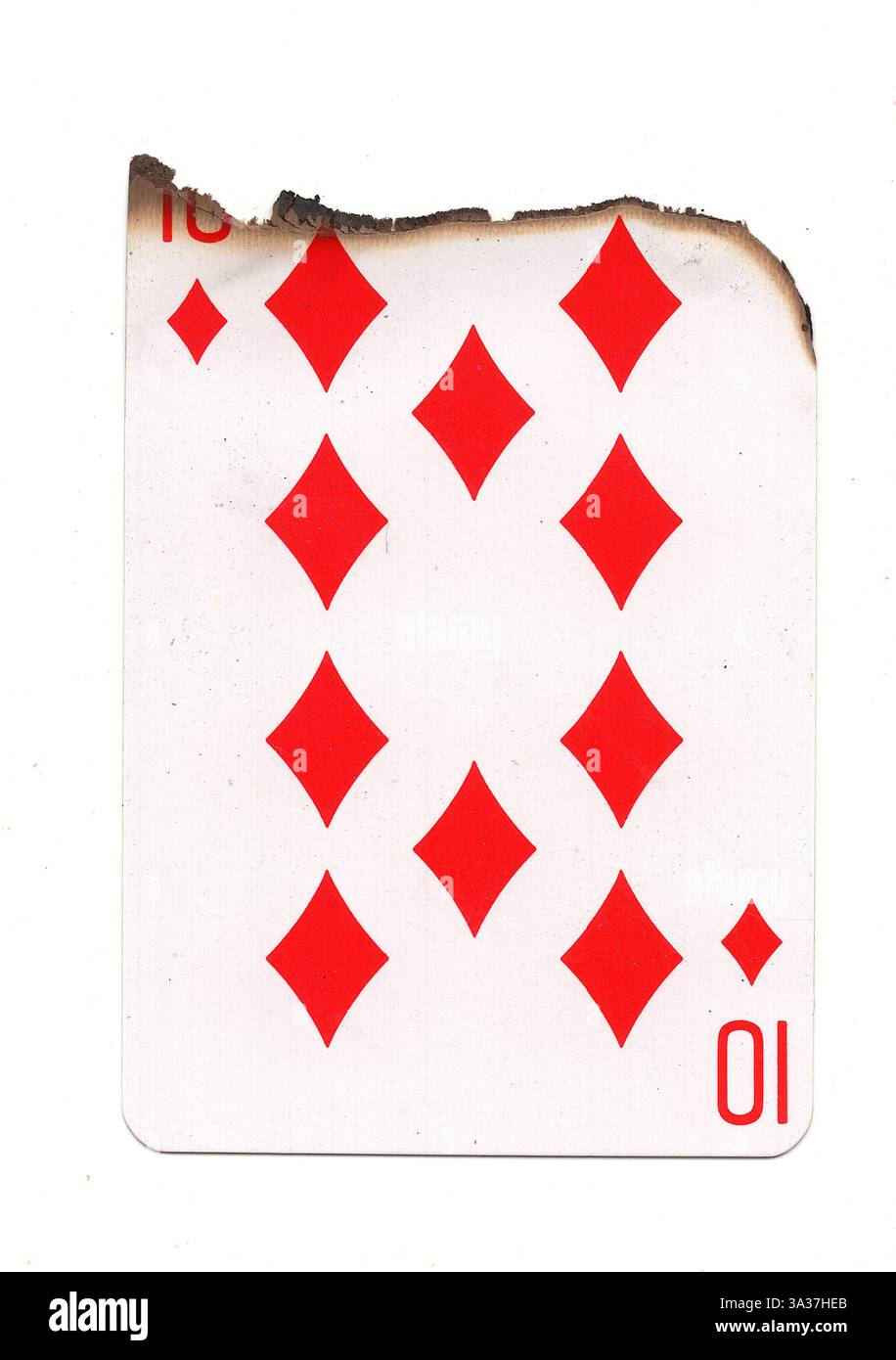 Partly burnt playing card in the suit of diamonds isolated on a white ...