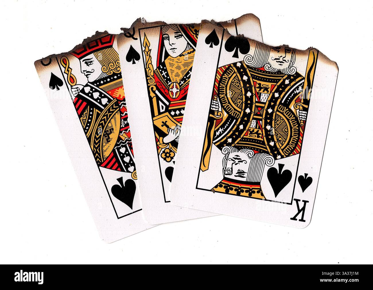 Partly burnt playing cards in the suit of spades isolated on a white ...