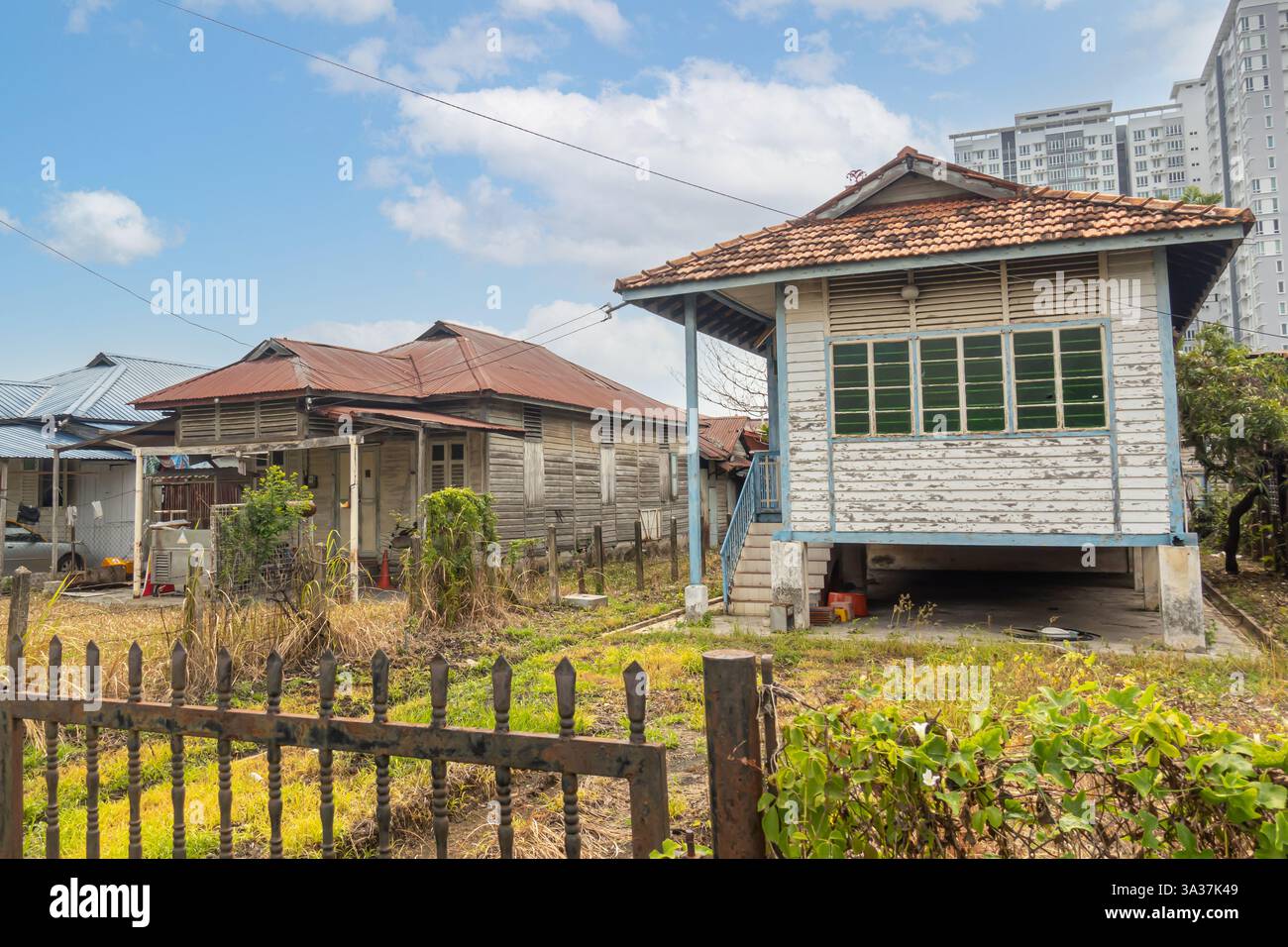 a traditional Malay house, wooden structures elevated on stilts ...