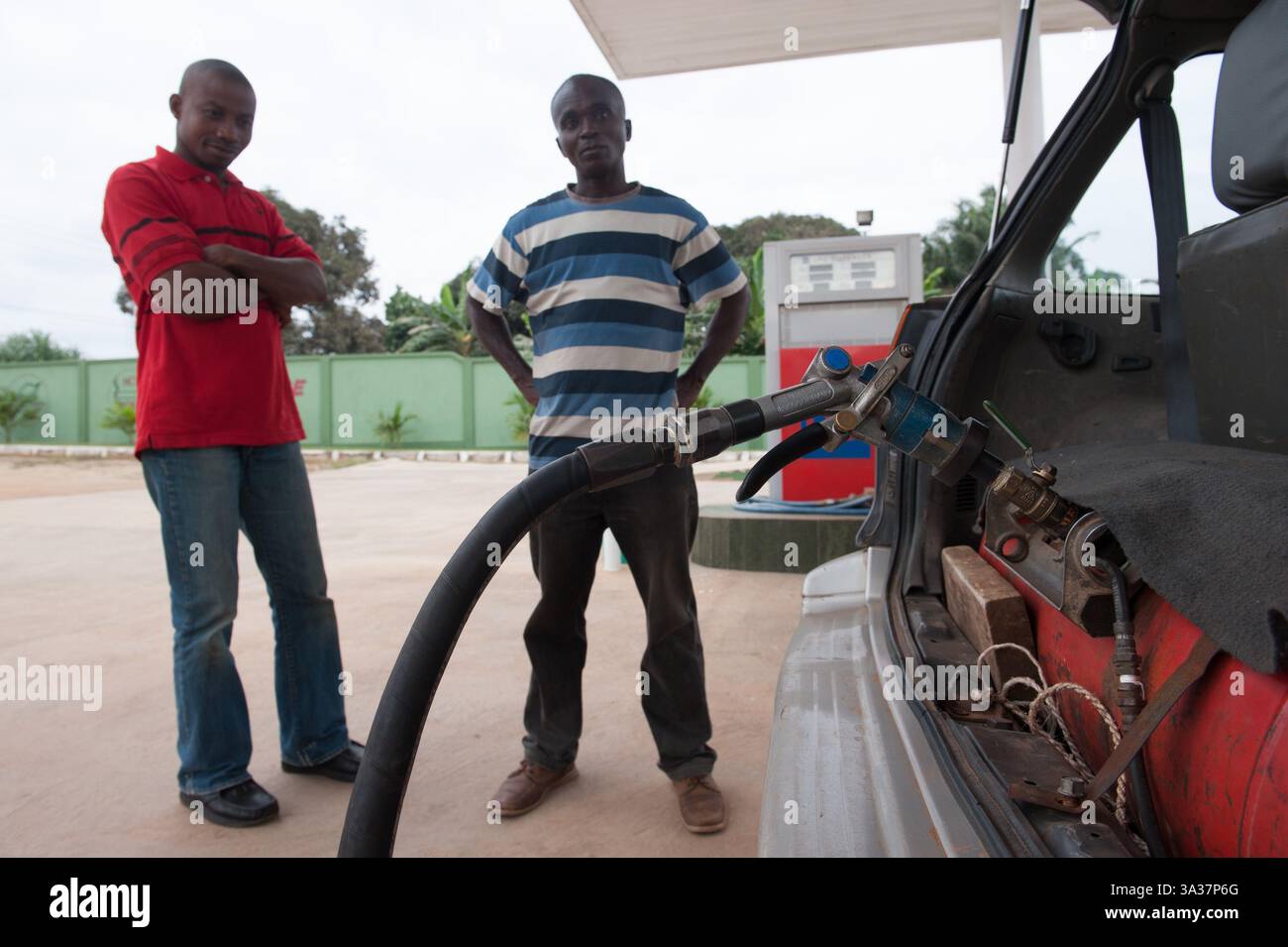 Aug. 16, 2013 - men getting gas at gas station (Credit Image: © Lou ...