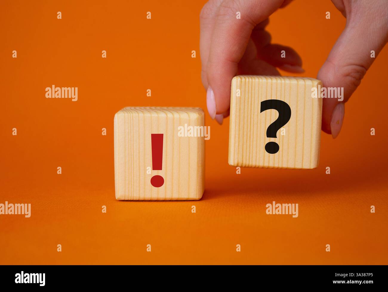 Question mark and exclamation mark symbol. Businessman hand is making a ...