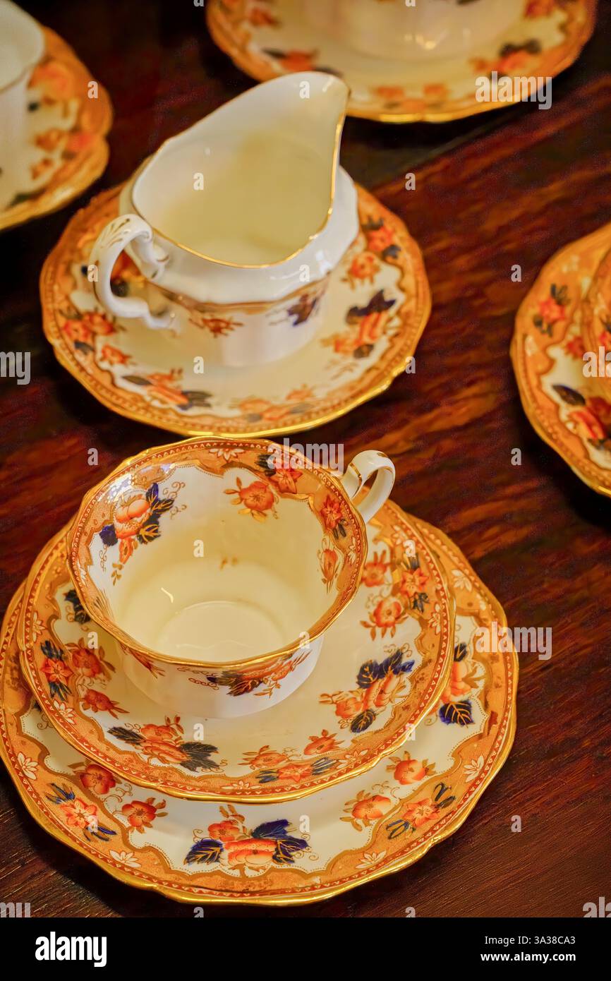 Classic fine china teacup featuring intricate golden edging and floral ...