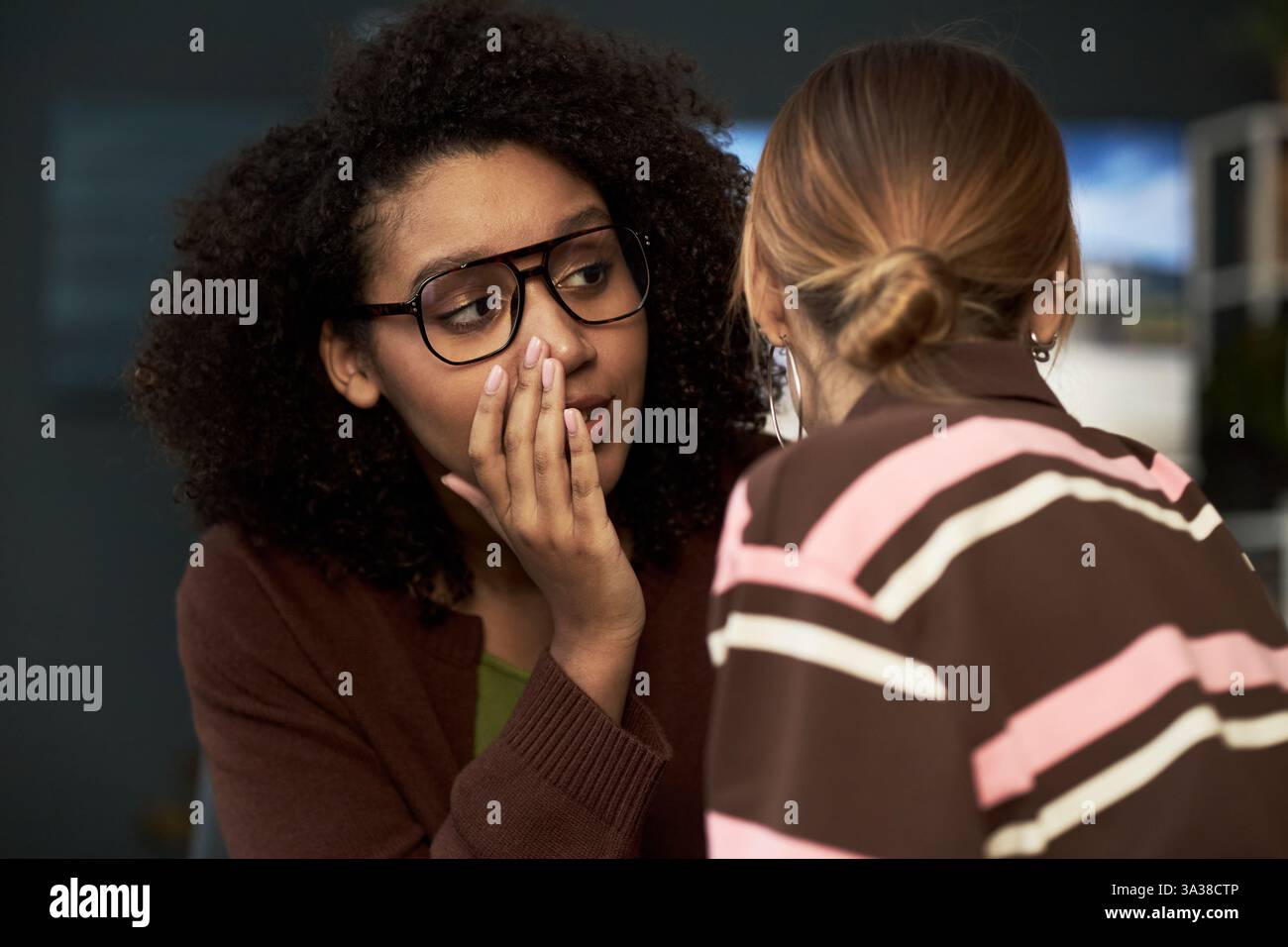 Two Women Gossiping About Their Colleagues Stock Photo - Alamy