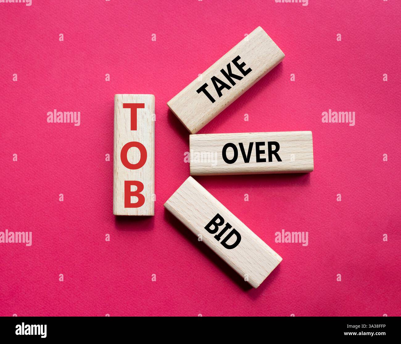 TOB - Take Over Bid. Wooden cubes with words TOB. Beautiful red ...
